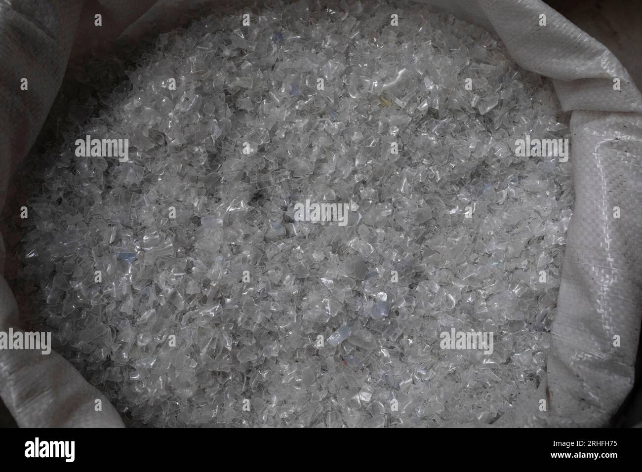 Flakes of crushed plastic bottles as raw material for further ...
