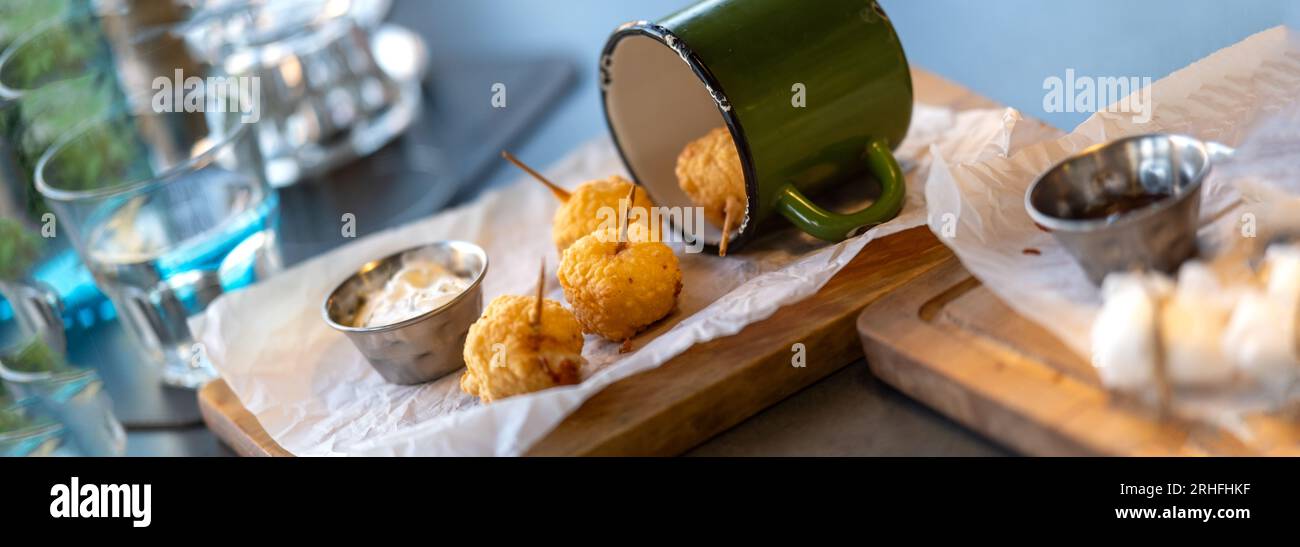 Fried cheese balls. Cheese balls in an old-fashioned mug. Serving ...