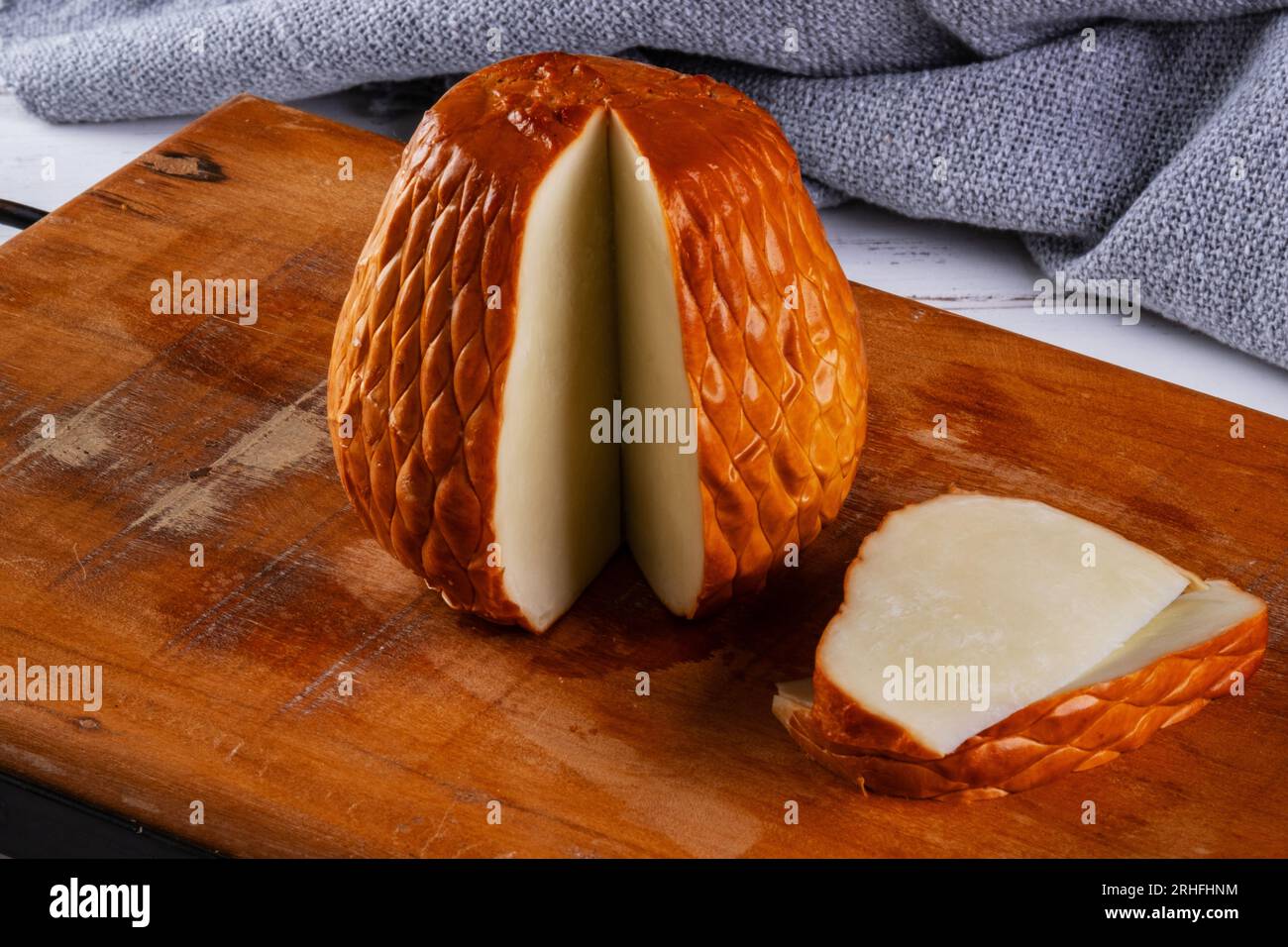 smoked provolone made with buffalo milk and slices Stock Photo - Alamy