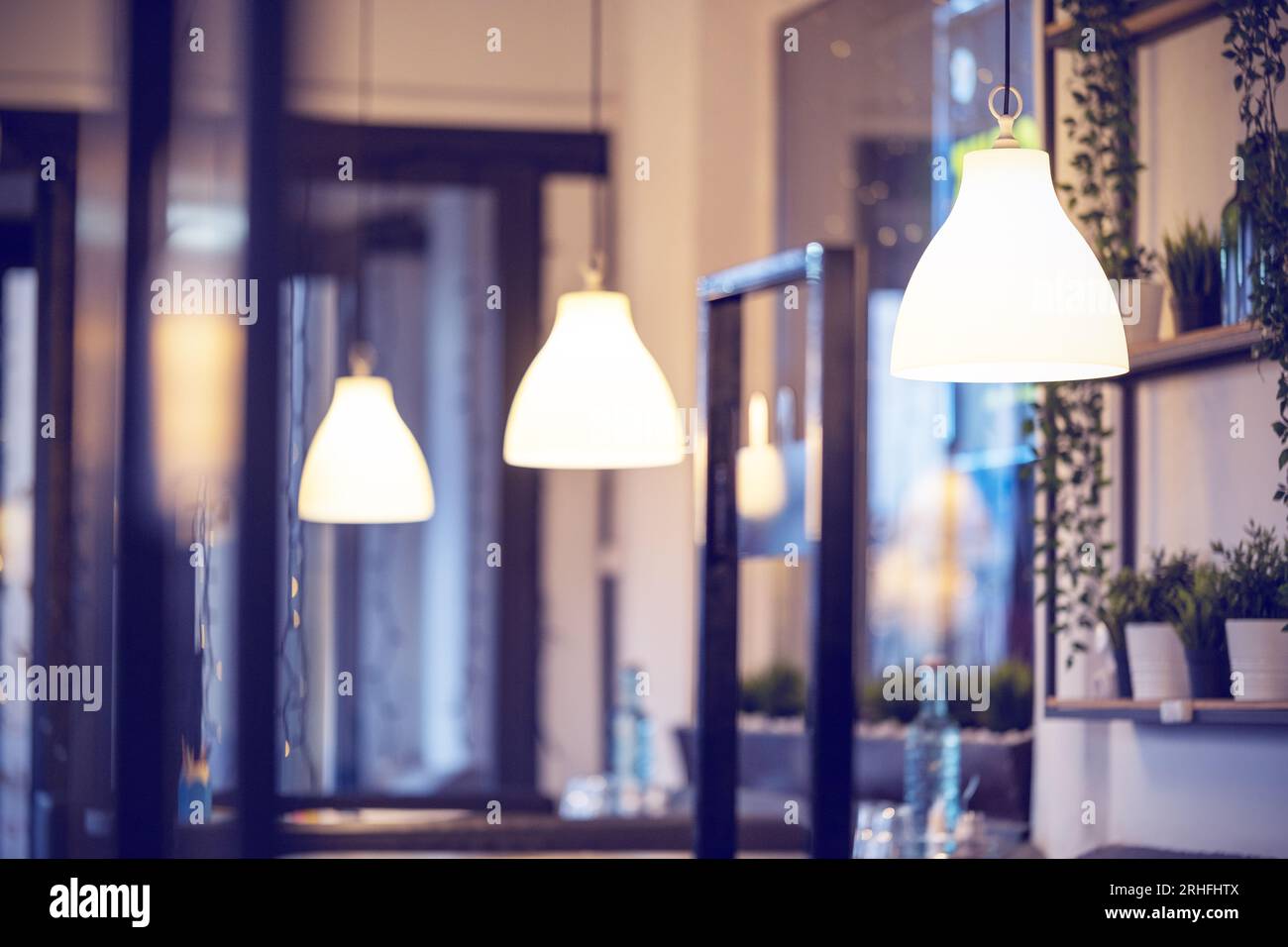 A row of lamps in the interior of the restaurant. Modern lighting ...