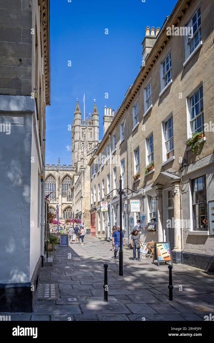 Bath Abbey tower seen through narrow Church Street in Bath, UK on 16 ...