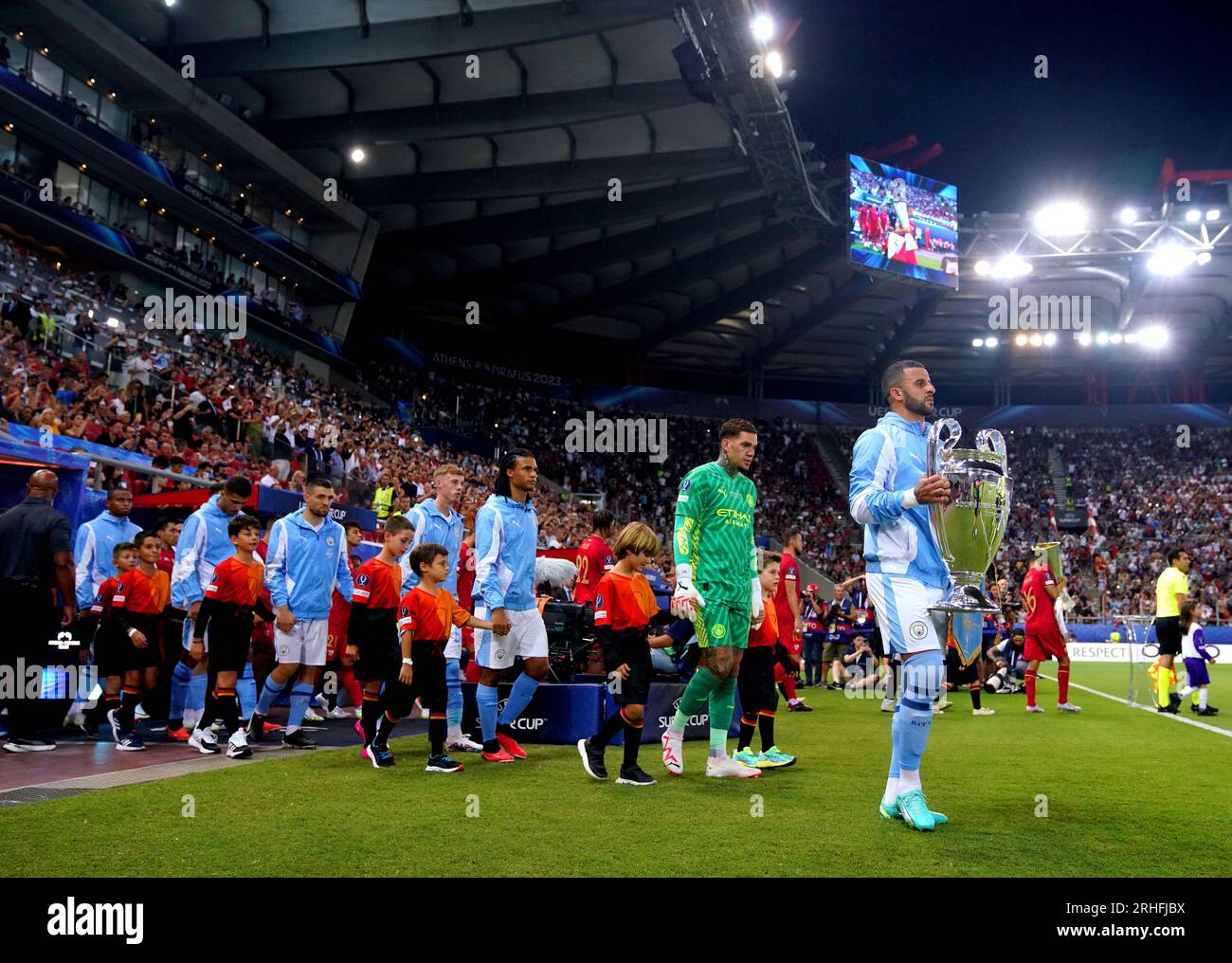 Manchester City's Kyle Walker walks out holding the UEFA Champions ...