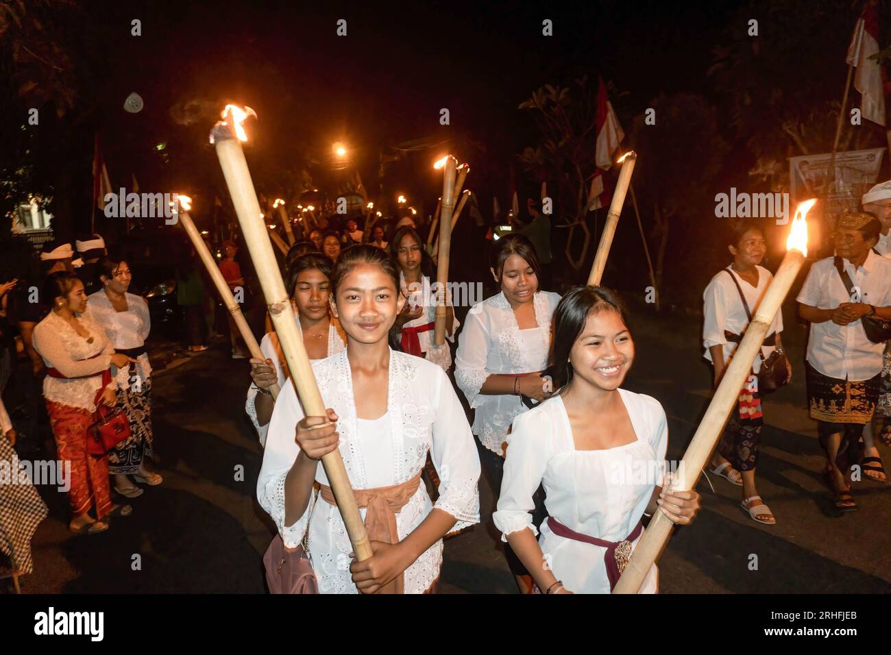A group of women wearing traditional Bali costumes take part in the ...