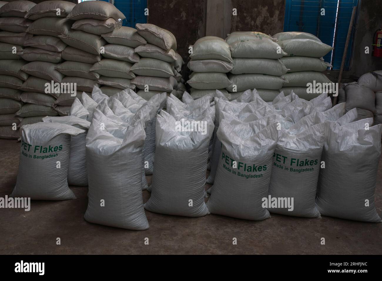 Sacks of plastic flakes made by used plastic bottles at a recycling ...