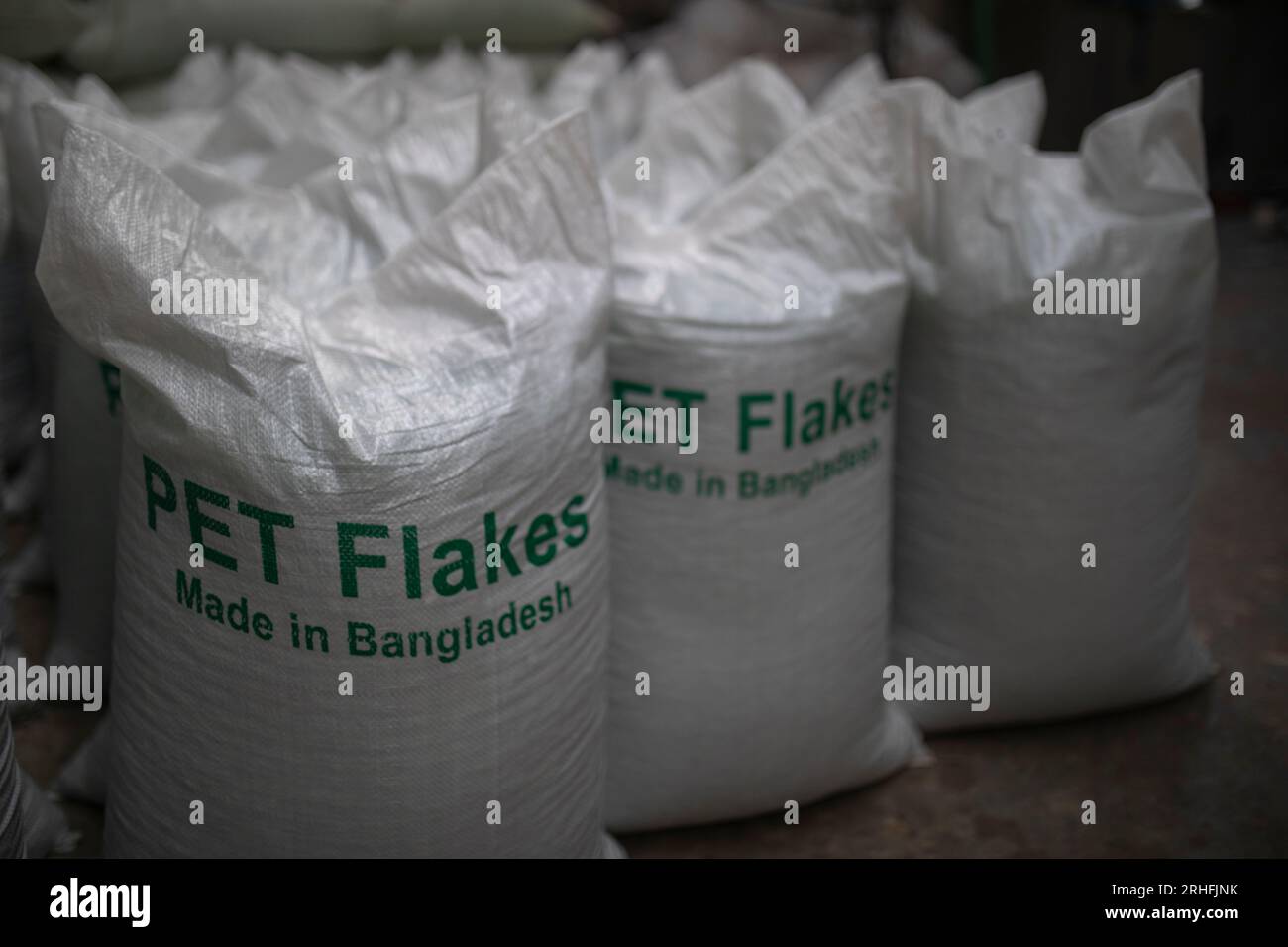 Sacks of plastic flakes made by used plastic bottles at a recycling ...