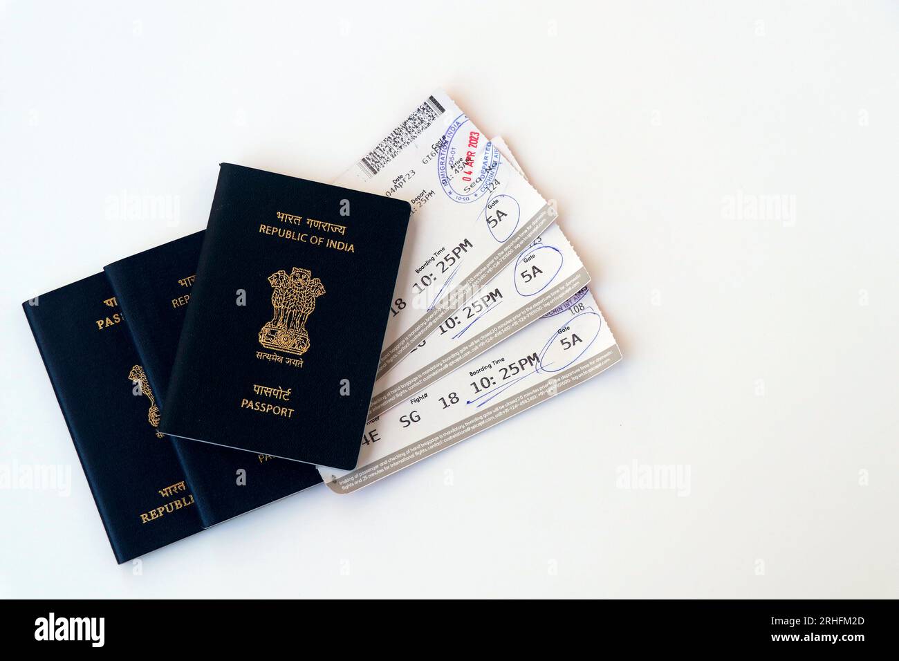 indian national blue passport with boarding pass on a white background ...