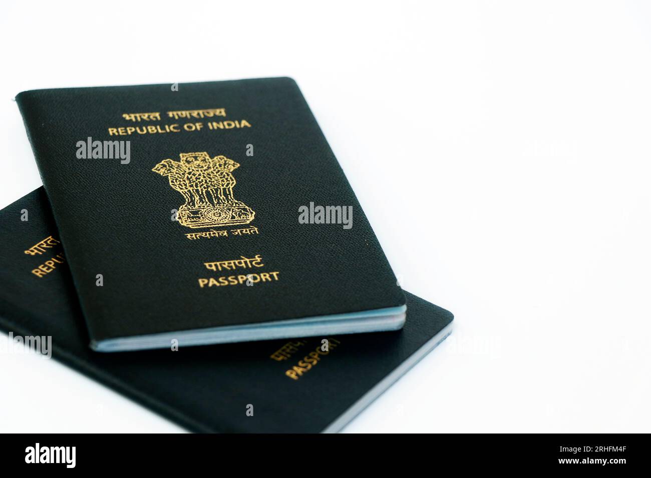 two indian national blue passport on a white background in close up ...