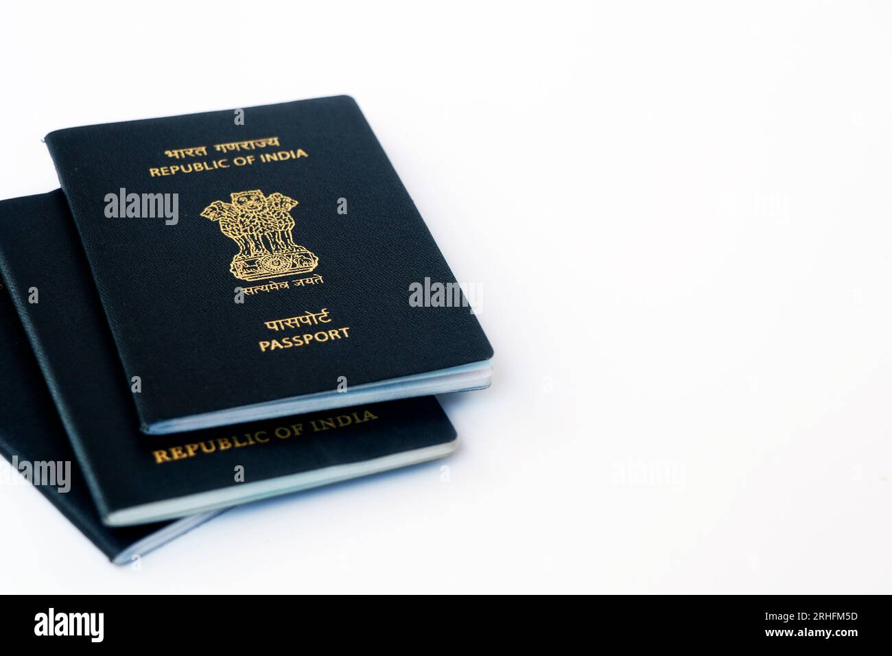 two indian national blue passport on a white background in close up ...