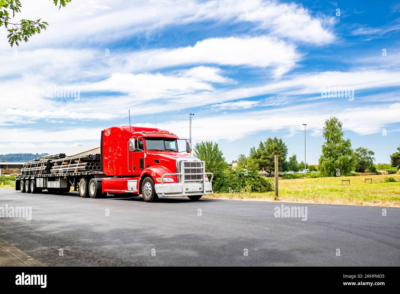 Long hauler big rig red semi truck tractor with grille guard and loaded ...
