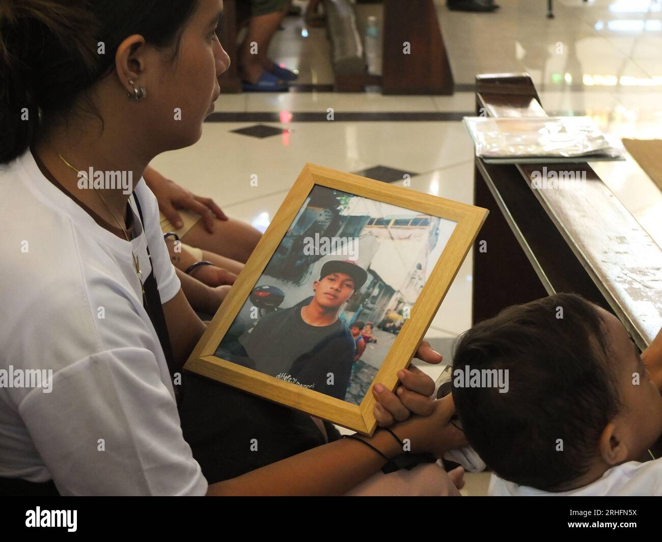 Caloocan, Philippines. 16th Aug, 2023. Jessa, Jemboy's sister holds her brother's picture during ...