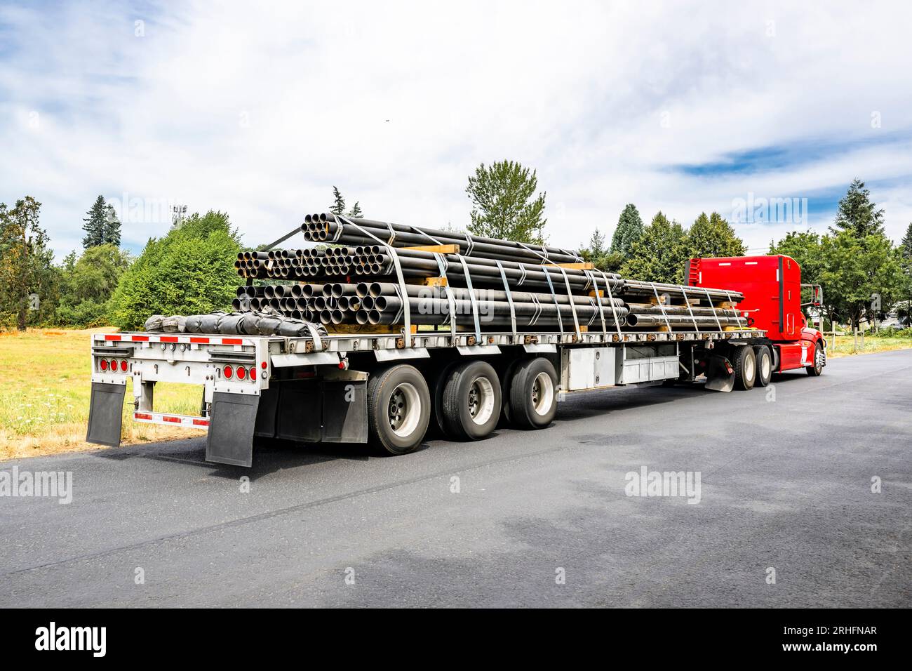Long hauler big rig red semi truck tractor with grille guard and loaded ...