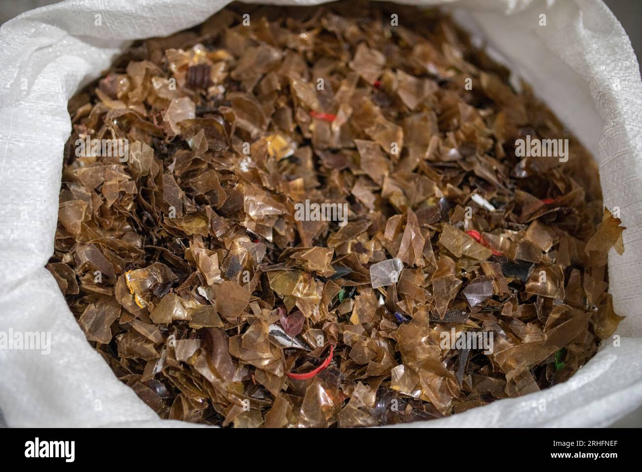 Flakes of crushed plastic bottles as raw material for further ...