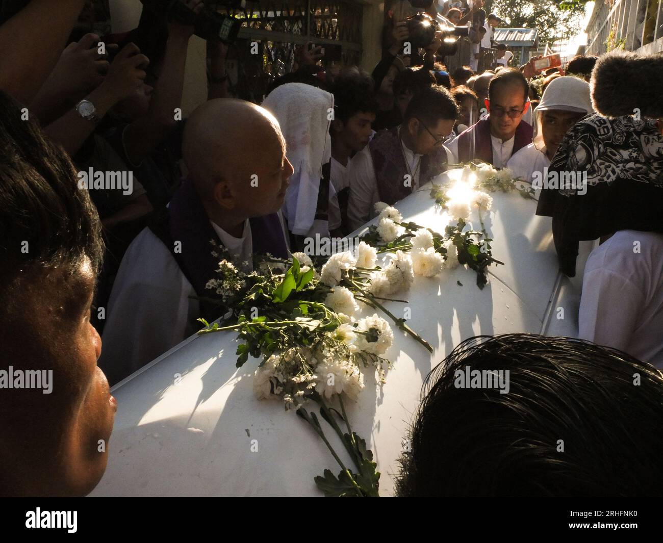 Caloocan, Philippines. 16th Aug, 2023. Father Robert Reyes carries ...