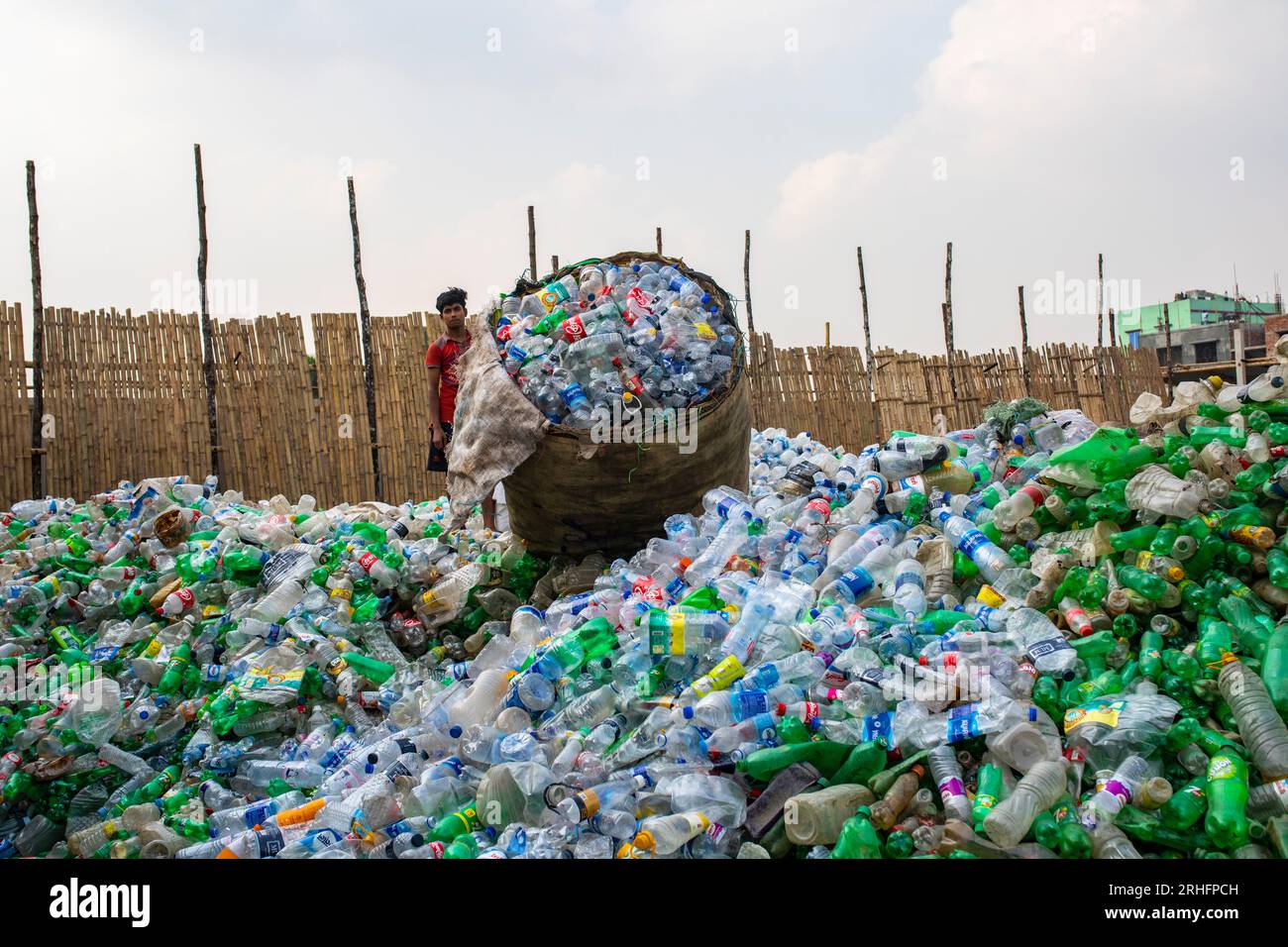A man works at a plastic recycling plant in Dhaka, Bangladesh Stock ...