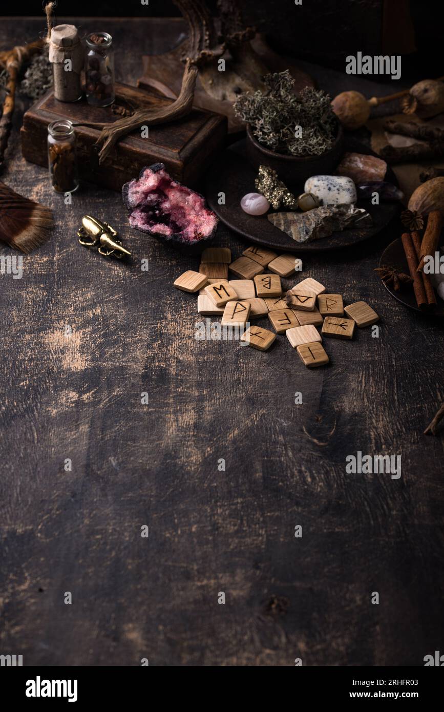 Esoteric magical background with runes Stock Photo - Alamy