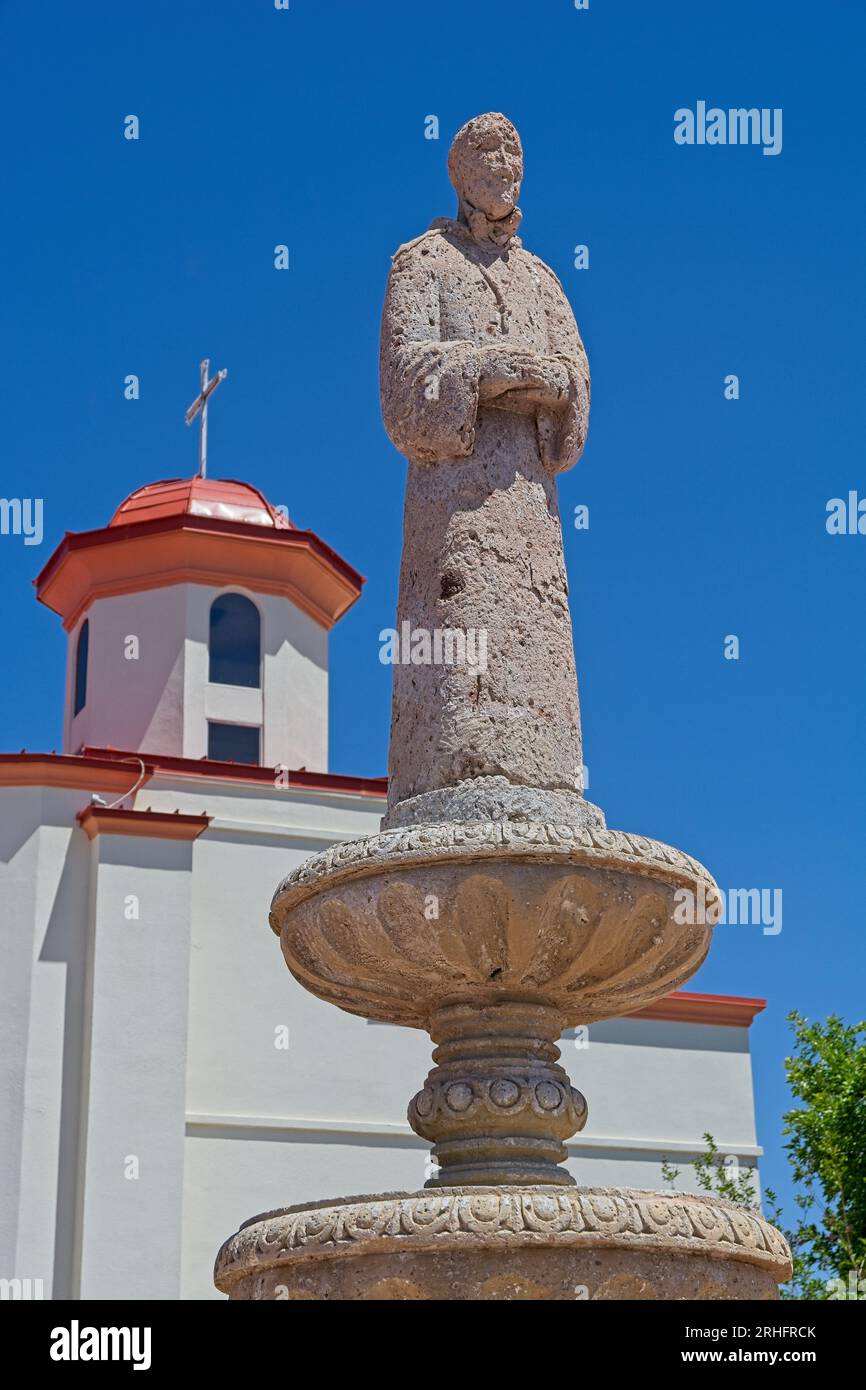 Weathered water fountain statue and steeple of Our Lady of Health ...
