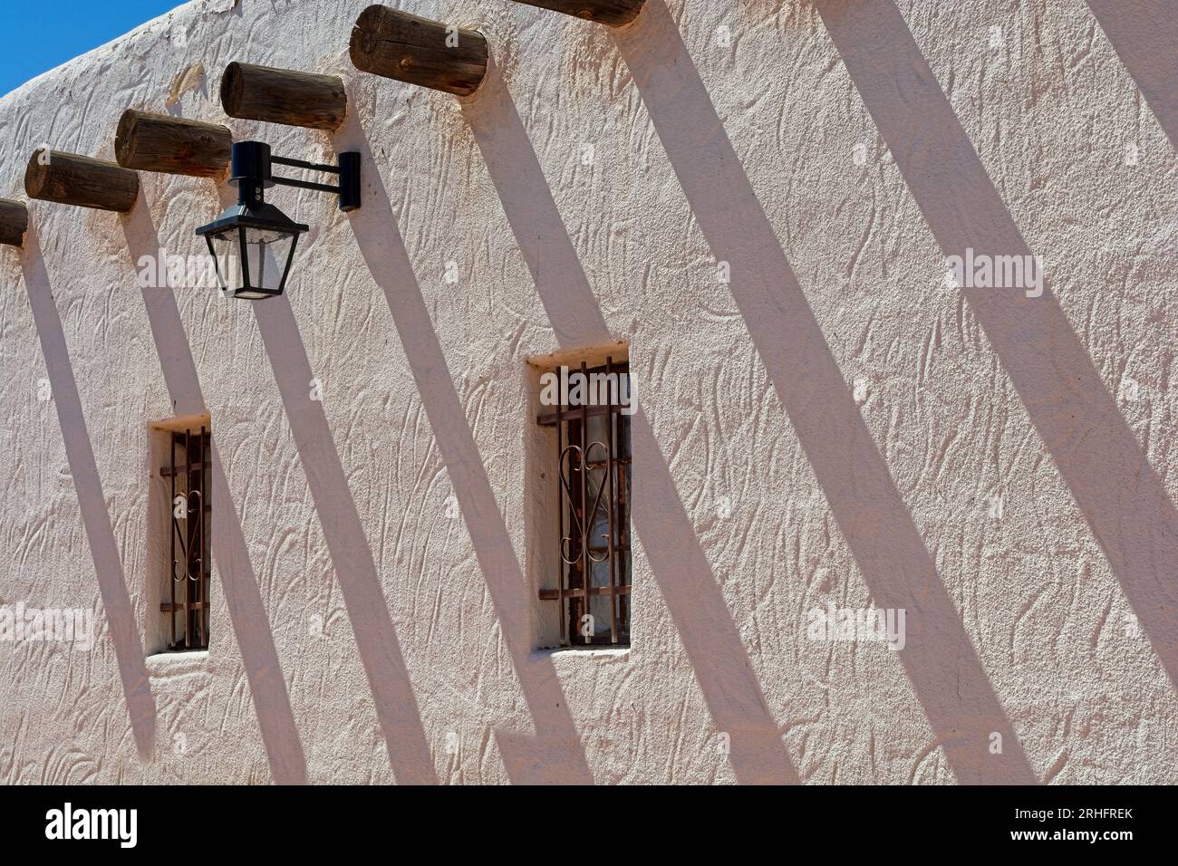 Details of adobe style building with exposed wooden viga beams ornate ...
