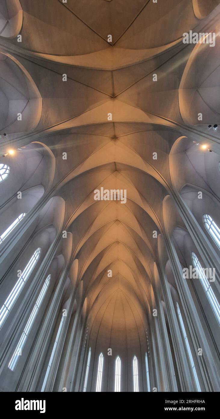 Interior of hallgrimur church with majestic ceiling and huge windows ...