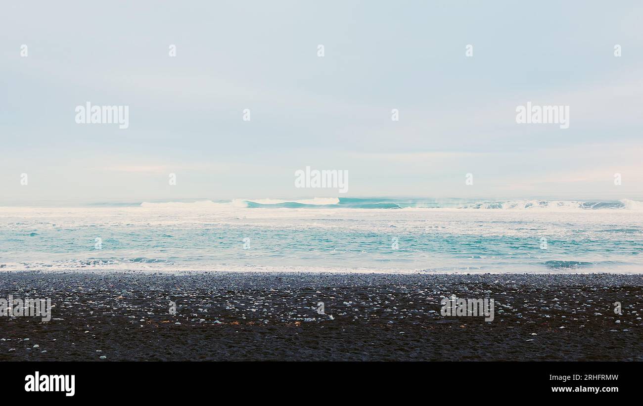 Black sand beach landscape in iceland with calm ocean waves, beautiful ...