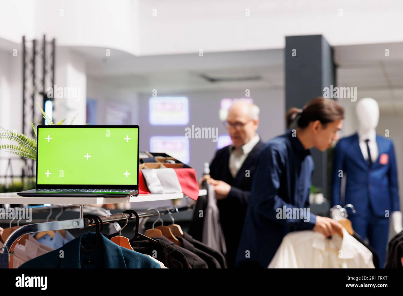 Open laptop computer with chroma key green screen standing on cloth ...