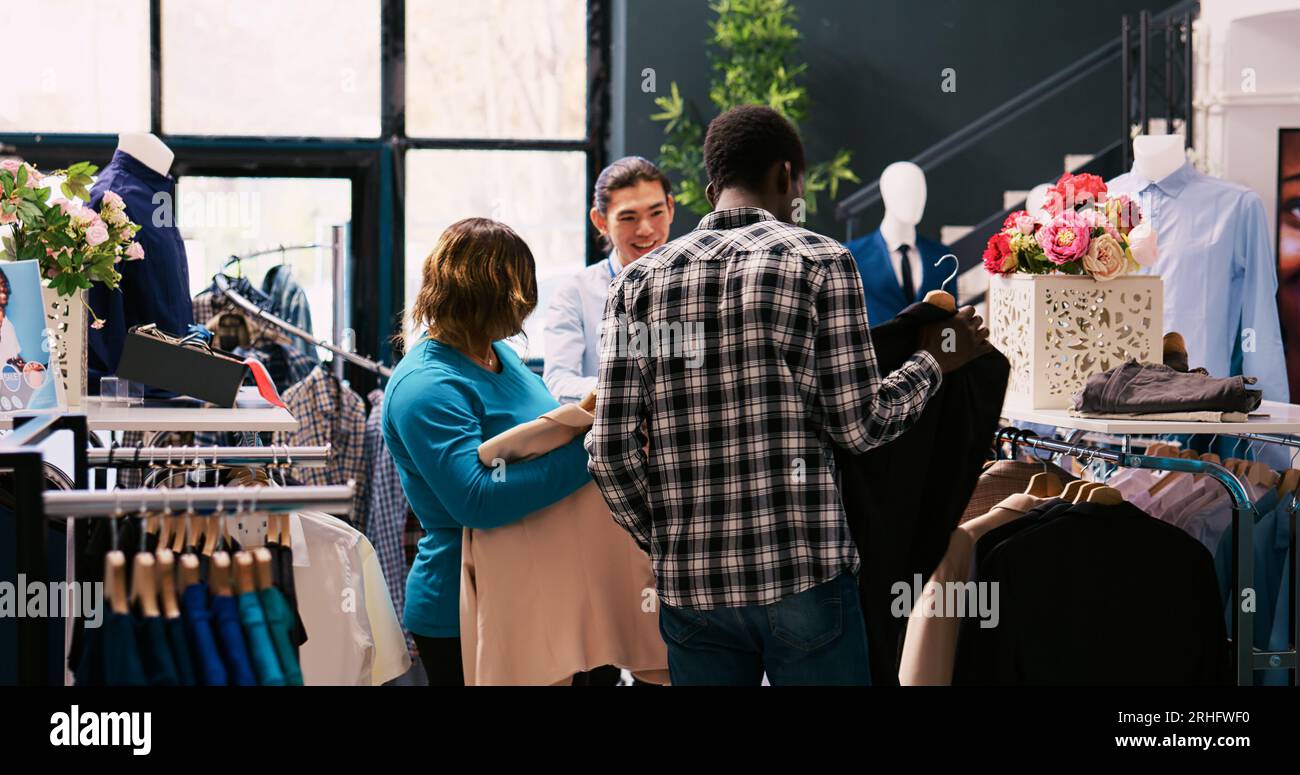 Manager helping customers outfits hi-res stock photography and images ...