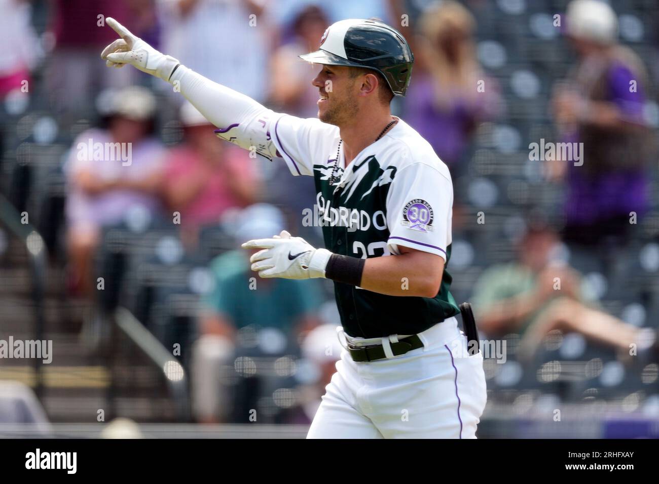 Colorado Rockies' Nolan Jones gestures as he crosses home plate after ...
