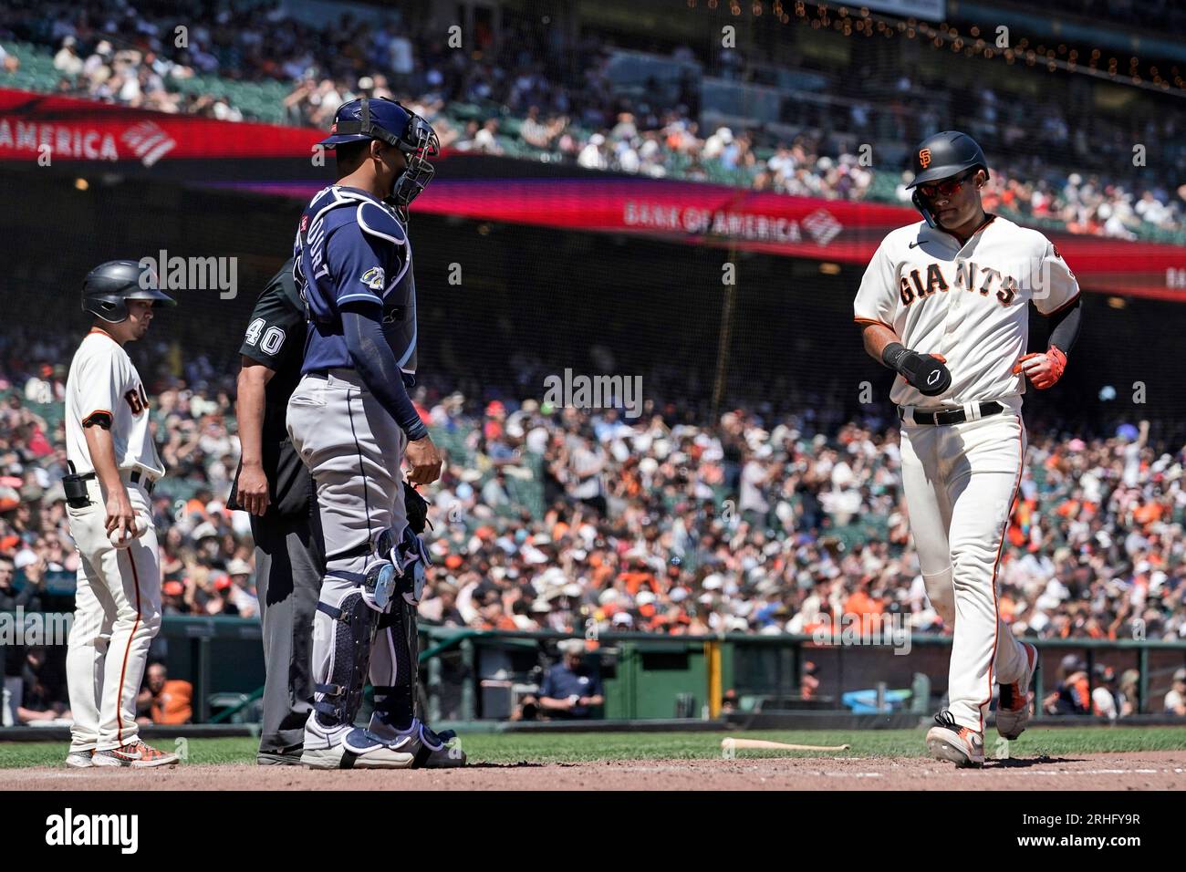 San Francisco Giants' Blake Sabol, right, scores against the Tampa Bay ...