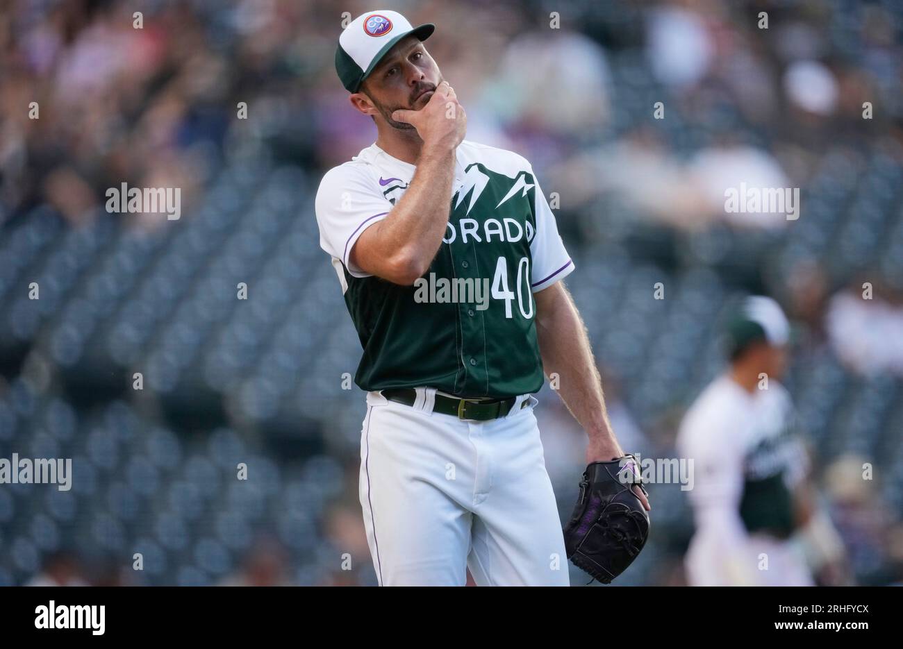 Colorado Rockies relief pitcher Tyler Kinley reacts after giving up a ...