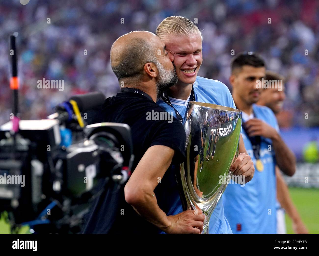 Manchester City manager Pep Guardiola kisses Erling Haaland on the ...