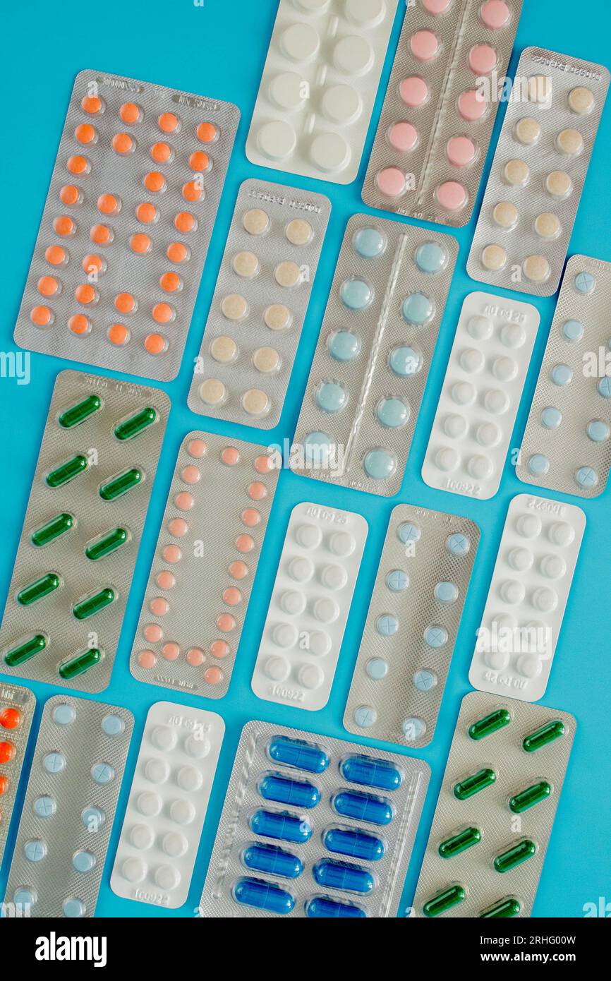 Colorful of tablets and capsules pill in blister packaging arranged ...