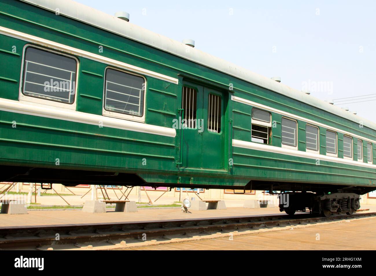 closeup of green train cars in a station Stock Photo - Alamy