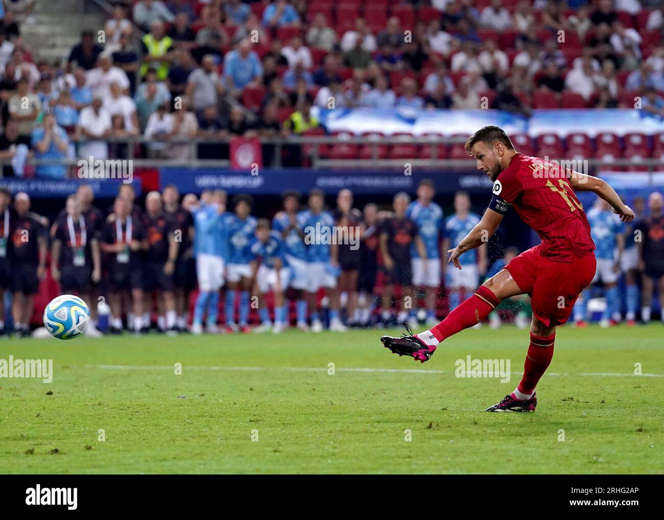 Sevilla's Ivan Rakitic scores the third penalty of the penalty shoot ...
