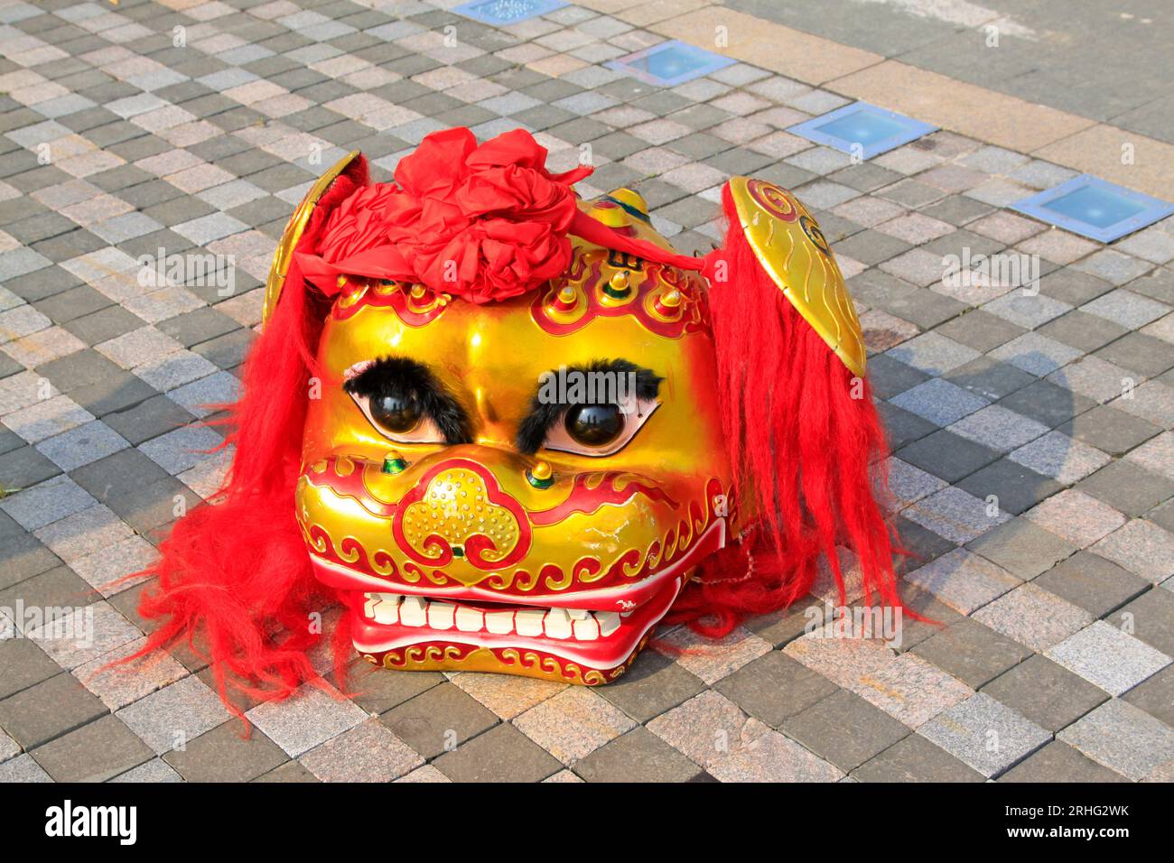 lion dance props on the gray ground Stock Photo - Alamy
