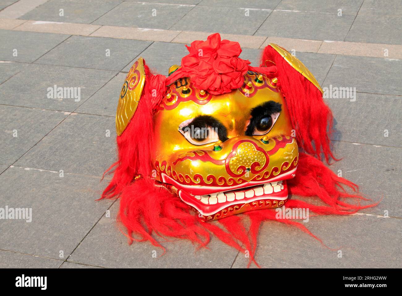 lion dance props on the gray ground Stock Photo - Alamy