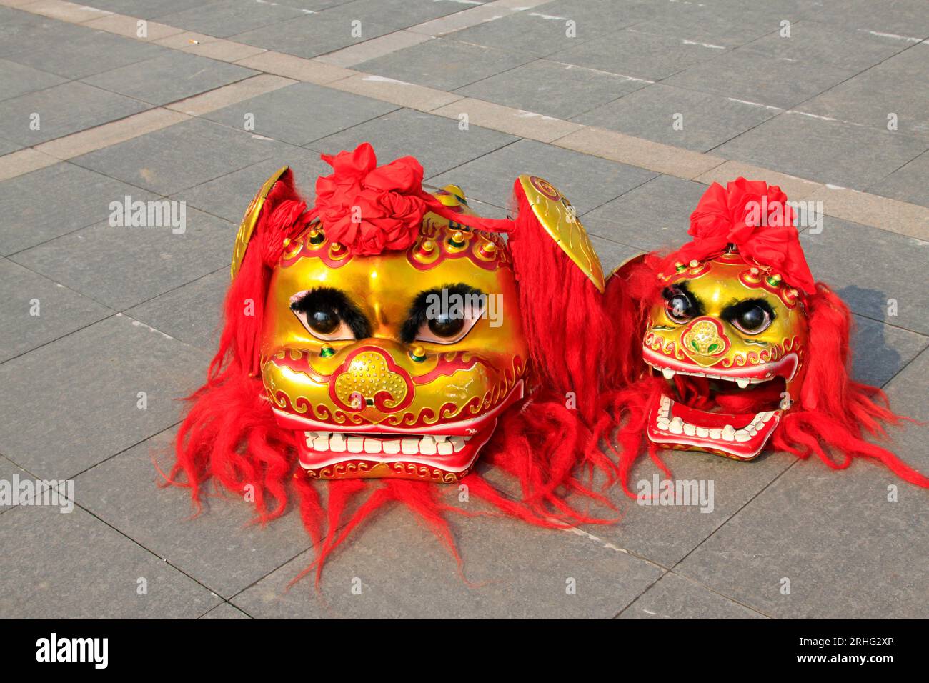 lion dance props on the gray ground Stock Photo - Alamy