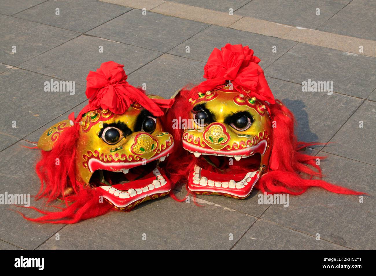 lion dance props on the gray ground Stock Photo - Alamy