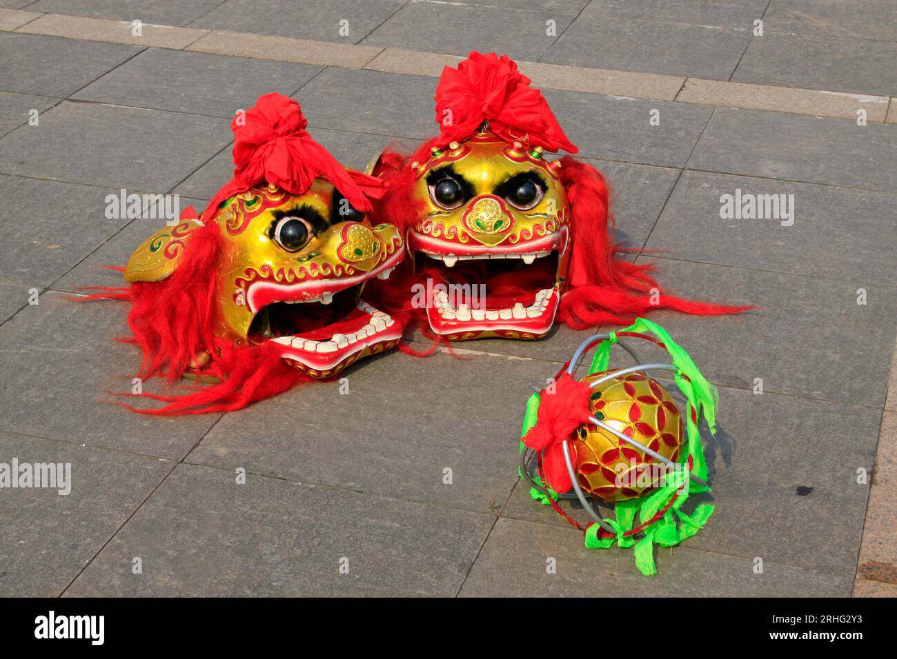 lion dance props on the gray ground Stock Photo - Alamy
