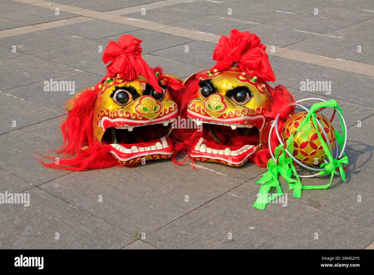 lion dance props on the gray ground Stock Photo - Alamy