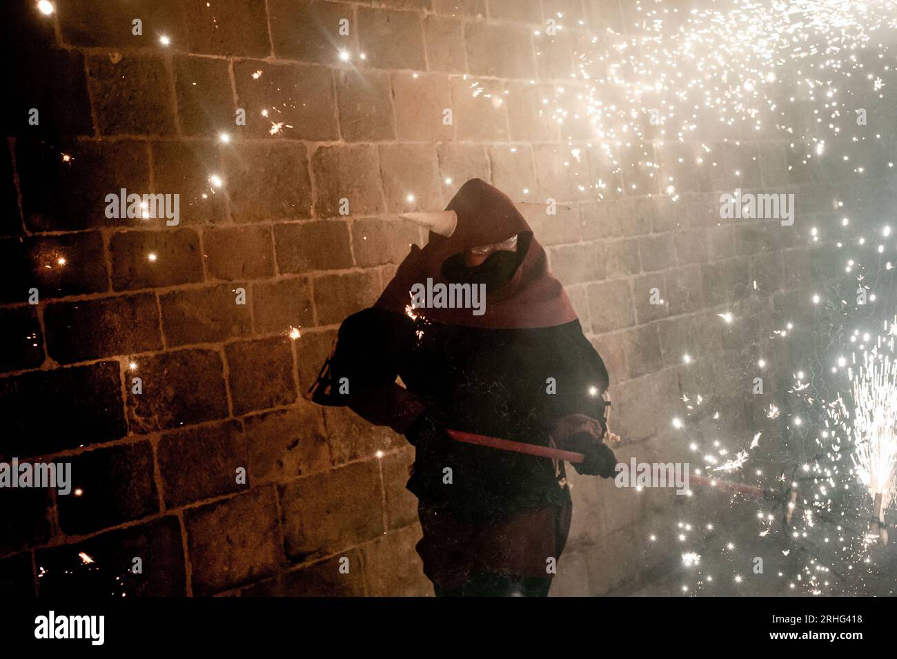 A devil runs amidst the pyrotechnics during the celebration of Sant Roc ...