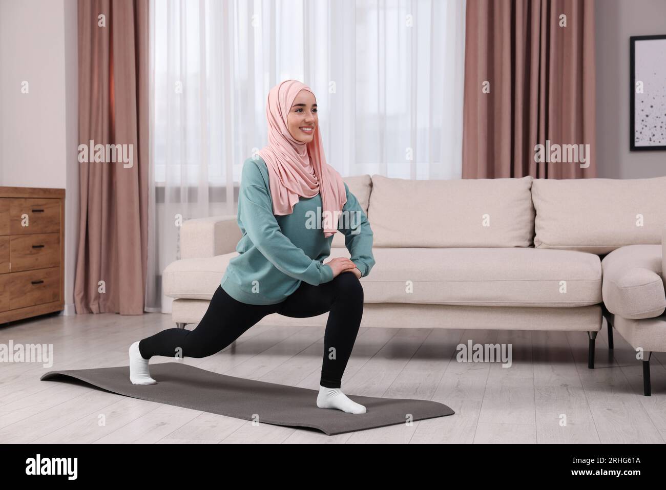 Woman wearing hijab exercise hi-res stock photography and images - Alamy
