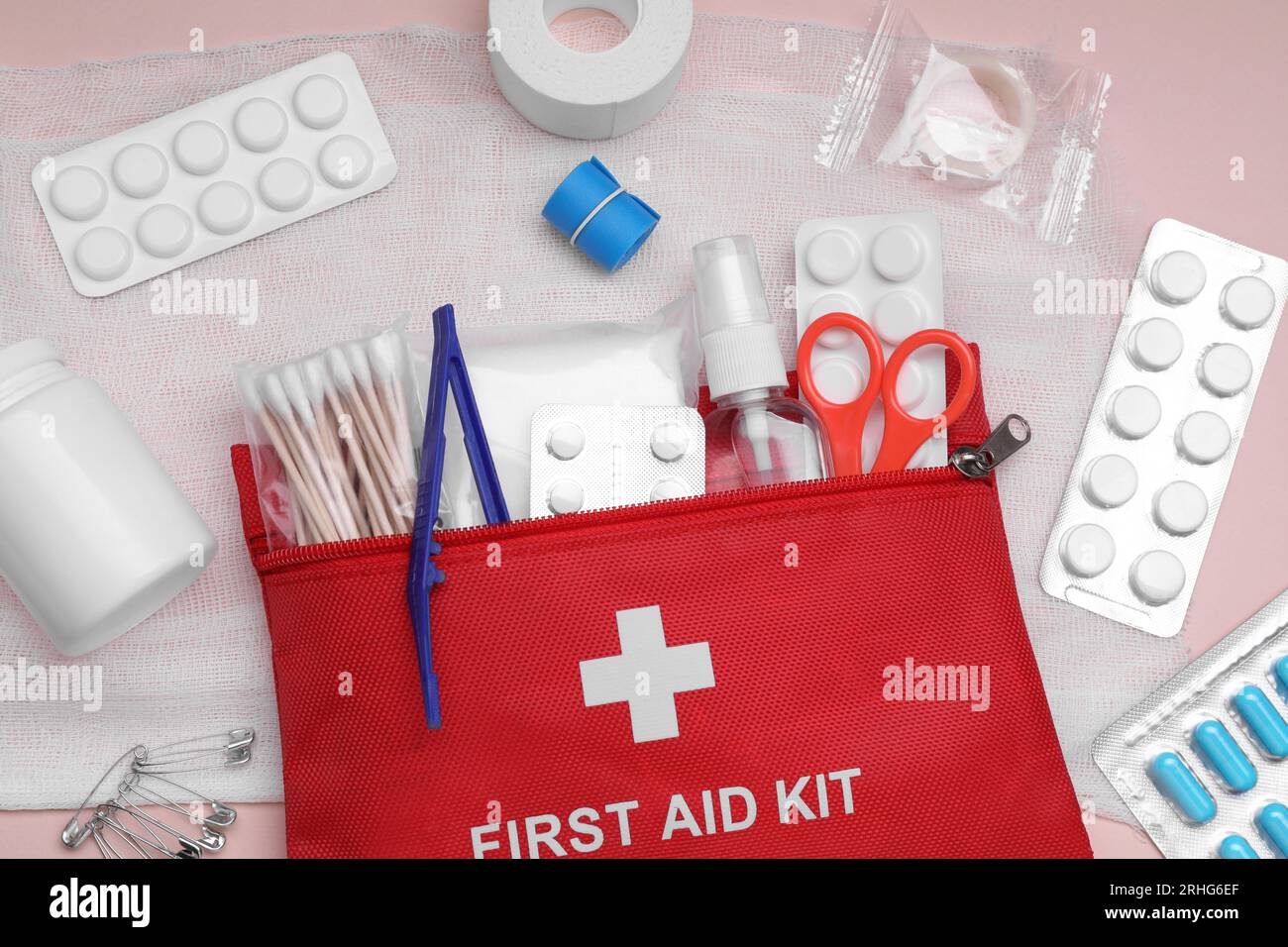 Flat lay composition with first aid kit on pink background Stock Photo ...