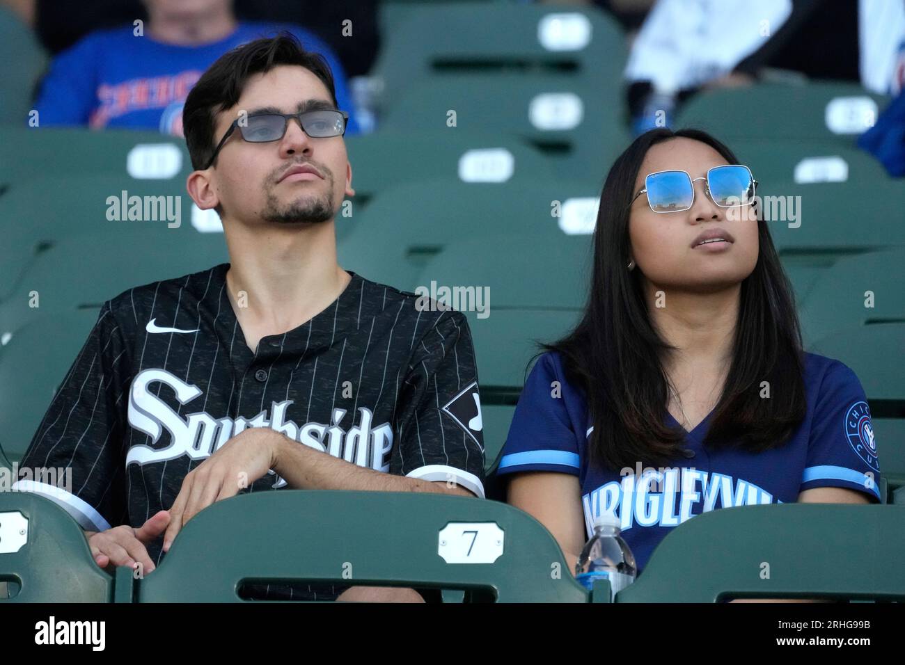 A Chicago White Sox fan and a Chicago Cubs fan wait for a baseball game ...