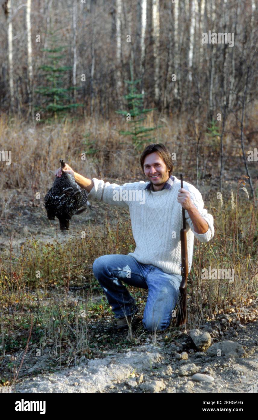 A vintage photograph from the year 1980 depicts a young male bird ...