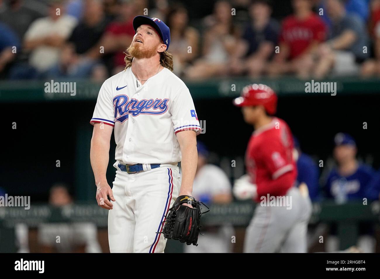Texas Rangers starting pitcher Jon Gray stands by the mound as left ...
