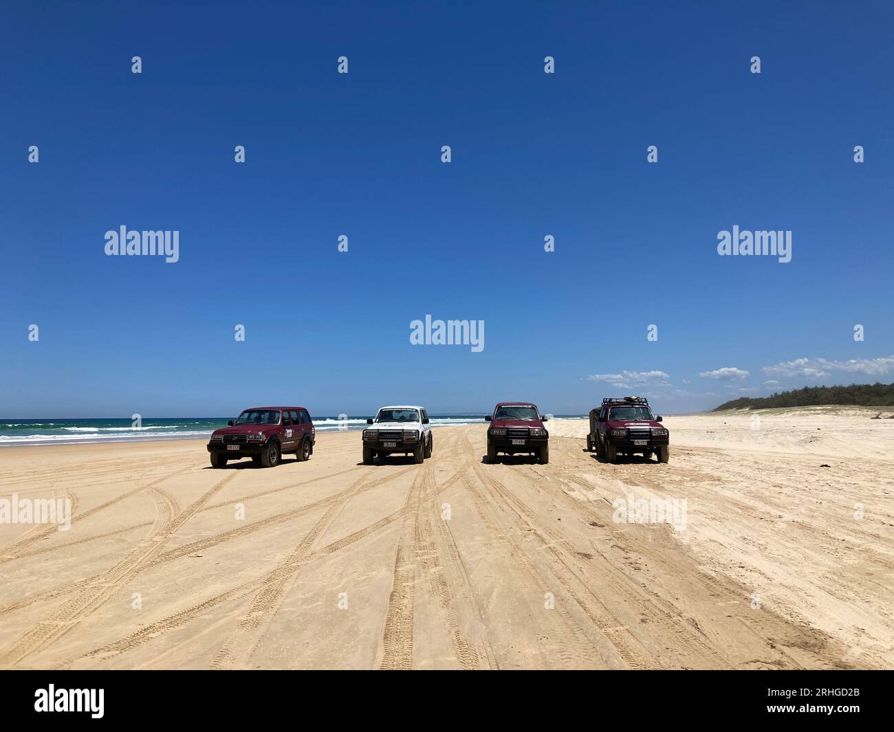 four 4x4 off-road cars on the beach on fraser island/ k’gari ...