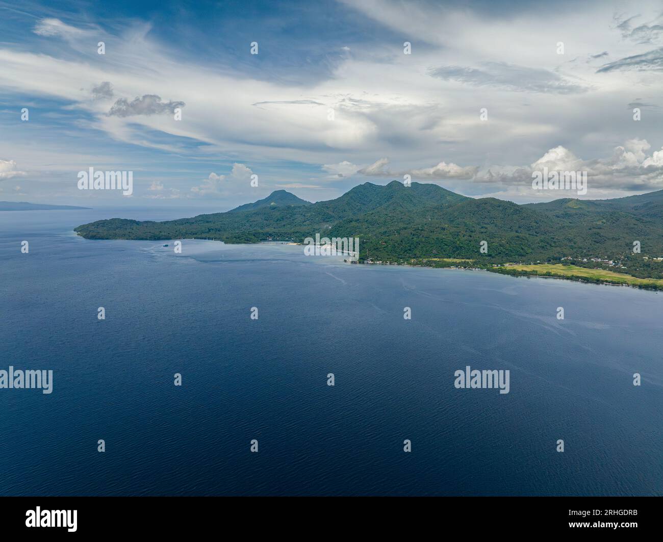 Camiguin Island with deep blue water. Blue sky and clouds. Philippines ...