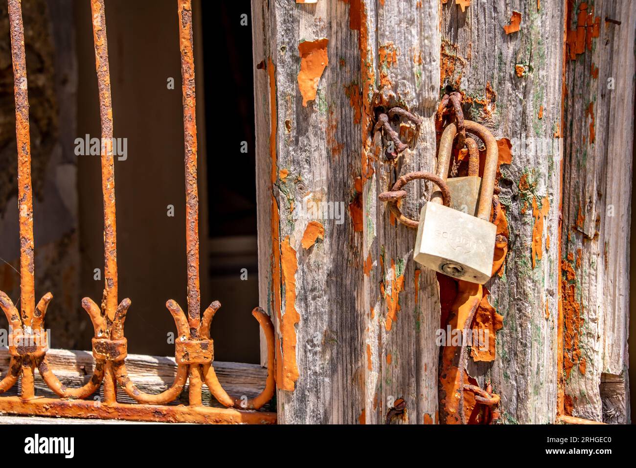 Old weather-worn Greek buildings-cracked walls and peeling paint, decay ...