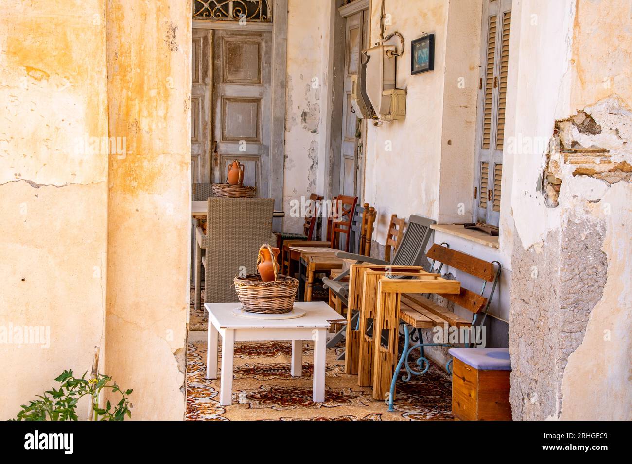 Old weather-worn Greek buildings-cracked walls and peeling paint, decay ...