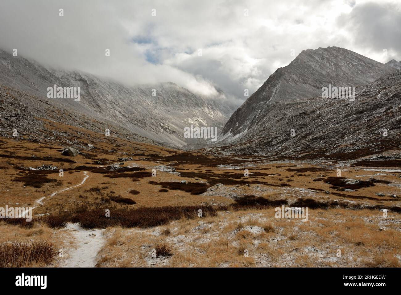 A narrow path crosses a picturesque valley, sprinkled with the first ...