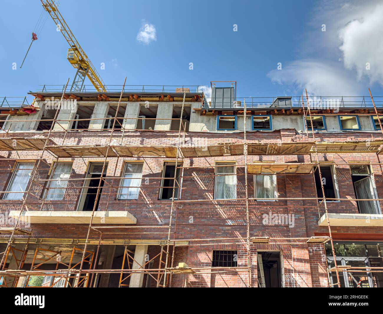 reconstruction of an old brick building. scaffolding on the facade ...